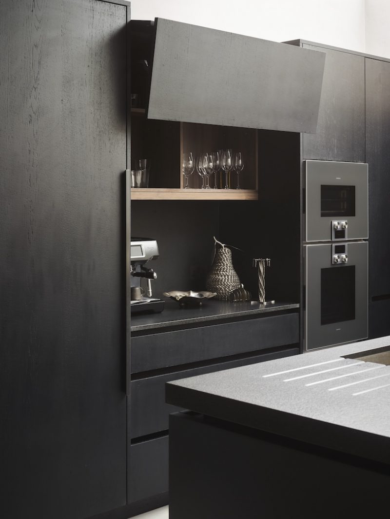 Black kitchen trend: How to warm up a bold minimalist kitchen